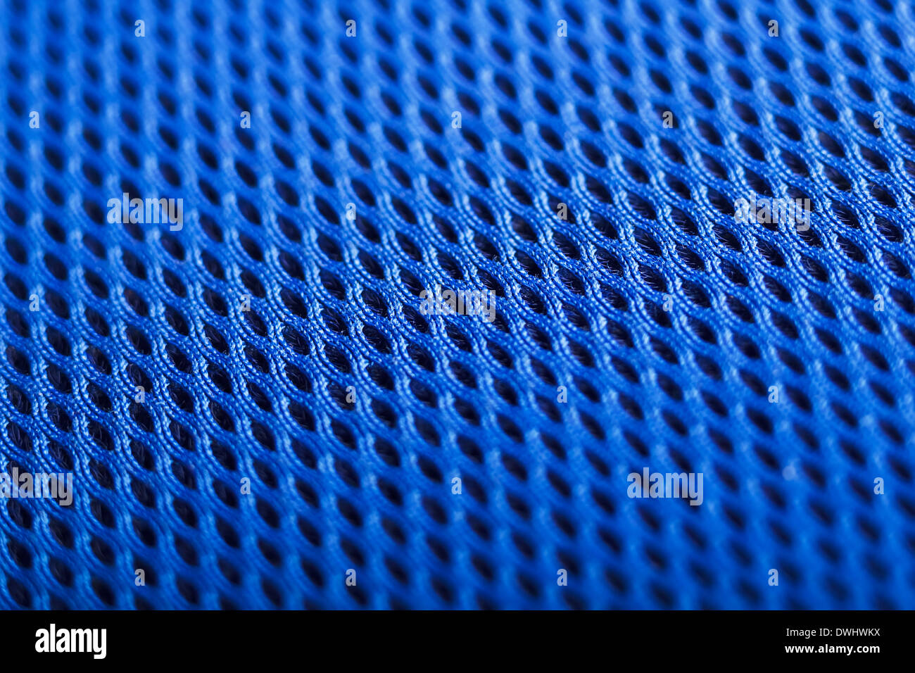 Blue background. Mesh fabric texture. Macro perspective Stock Photo - Alamy