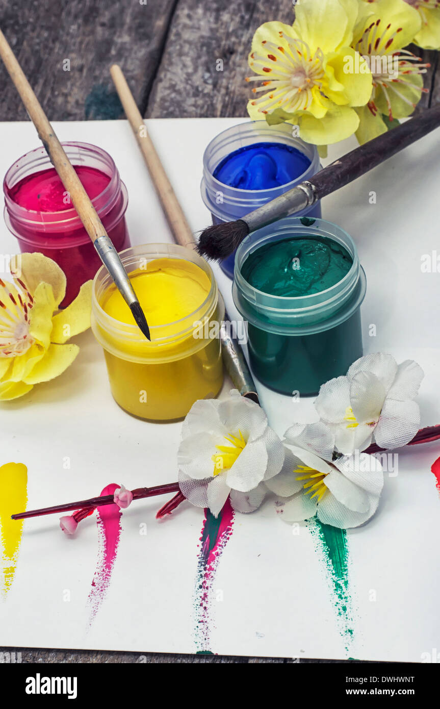 paint for painting and composition with spring flowers Stock Photo - Alamy