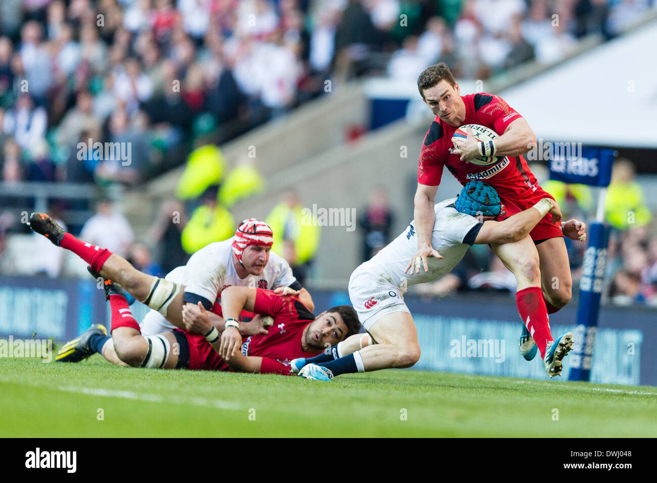 London, UK. 09th Mar, 2014. Wales winger George NORTH tries to beat the ...