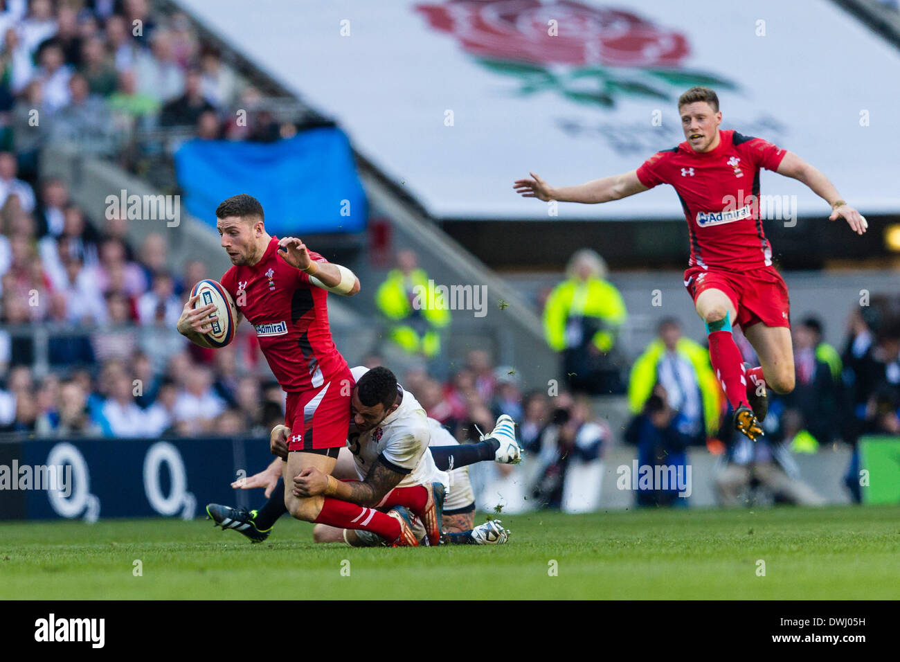 London, UK. 09th Mar, 2014. Wales winger Alex CUTHBERT tackled by ...