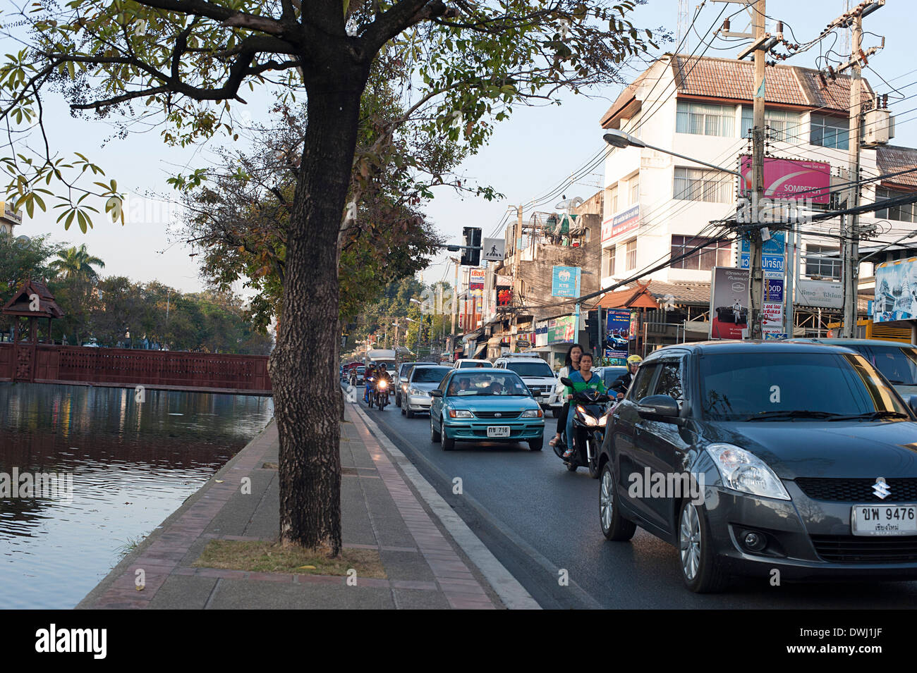 Busy road alongside the Ping Canal in Chiang Mai, Northern Thailand ...