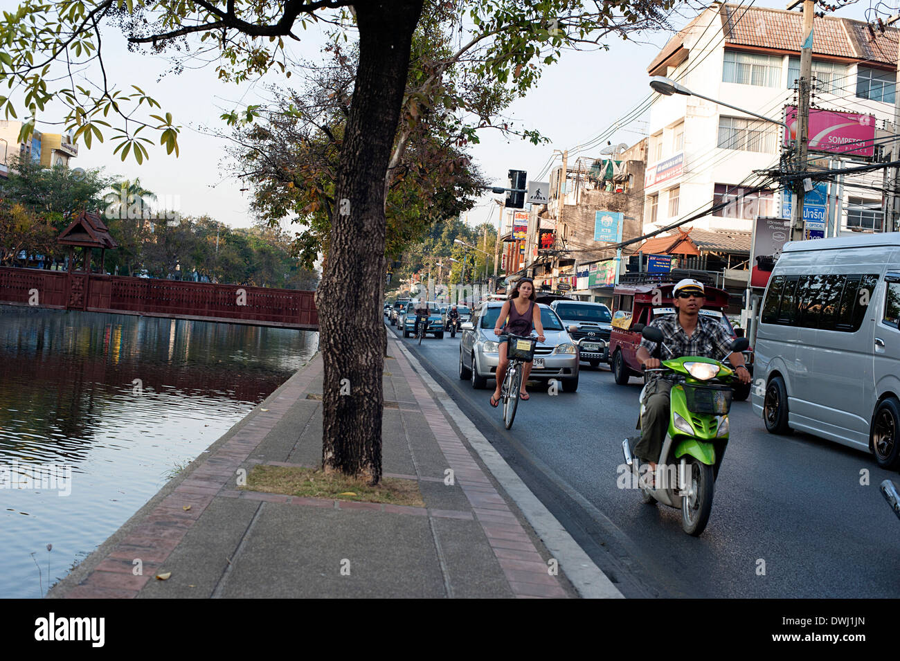 Busy road alongside the Ping Canal in Chiang Mai, Northern Thailand ...