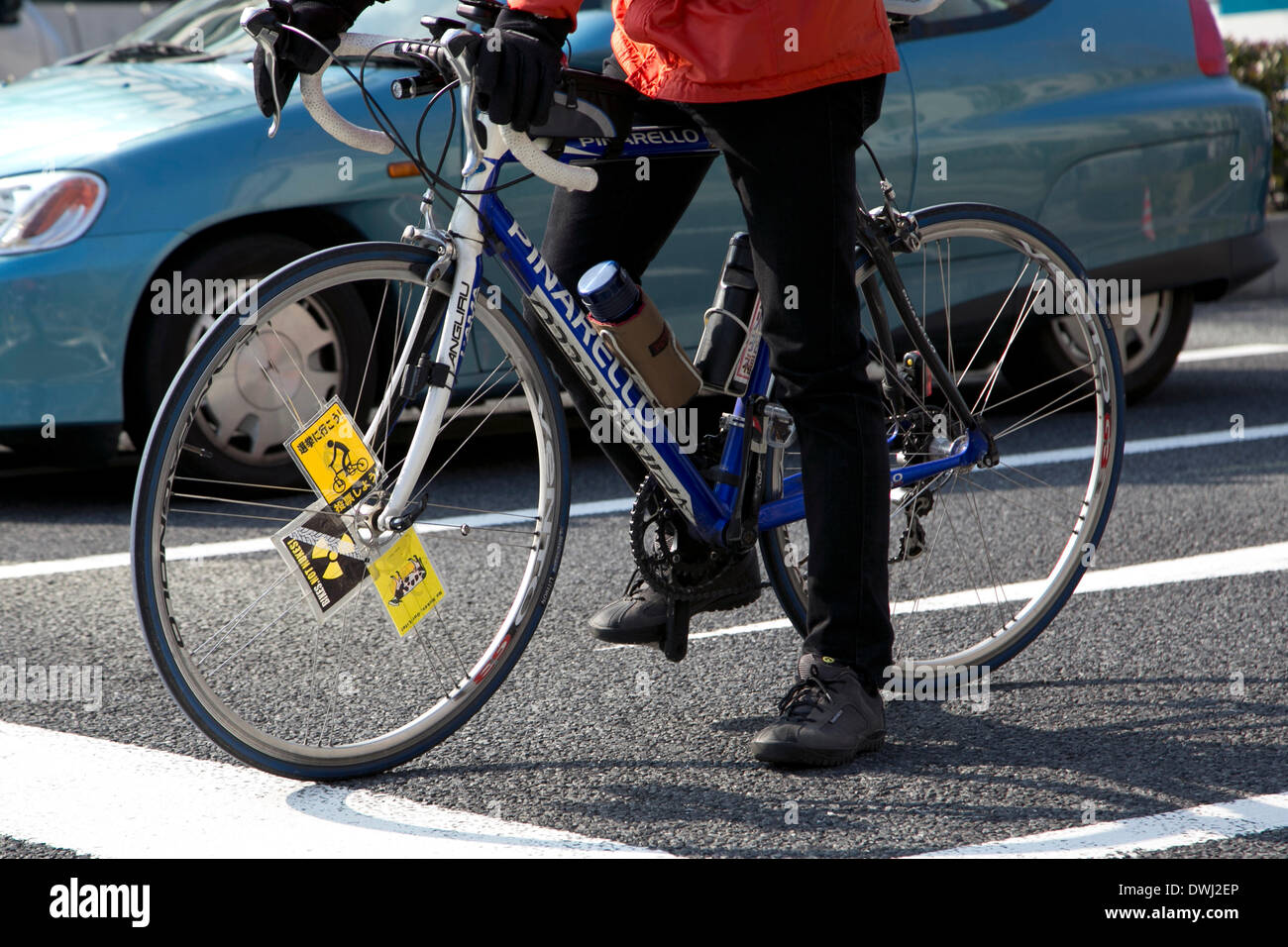 Tokyo, Japan - An anti-nuclear protestor on bicycle drives along the ...