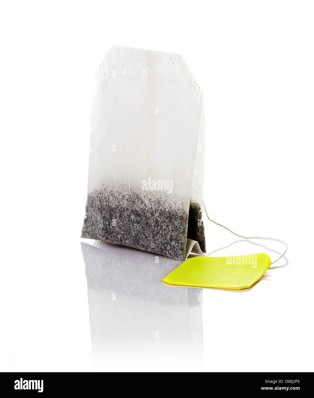 Teabag with yellow label isolated Stock Photo - Alamy