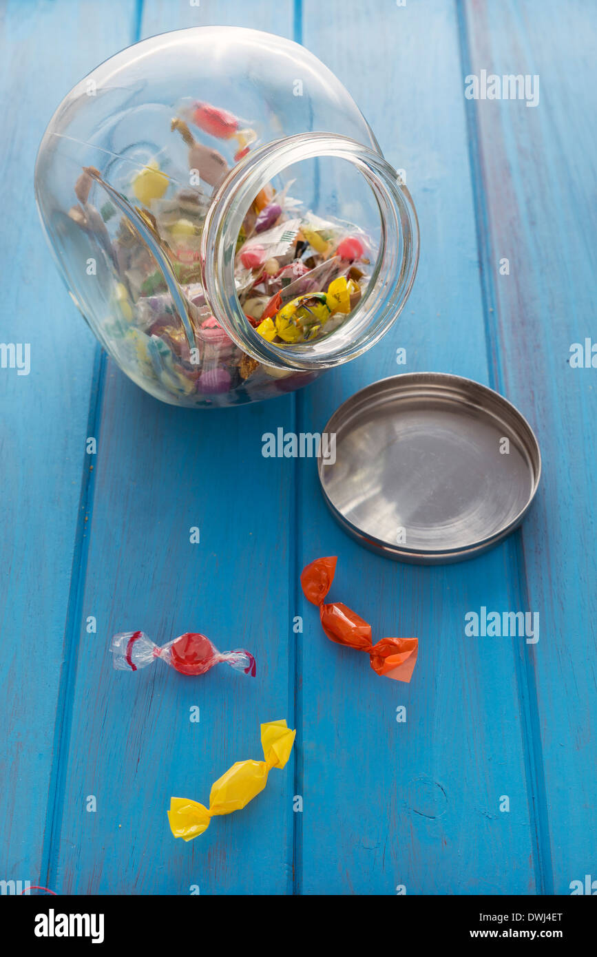 glass jar with mints on one wooden table. Lighting the backlighting ...