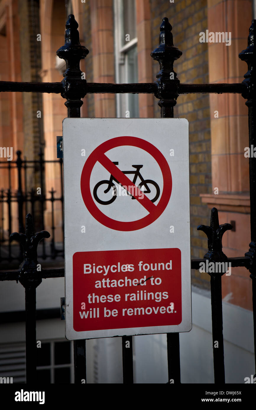 Warning sign on railings of the removal of Bicycles if they are ...
