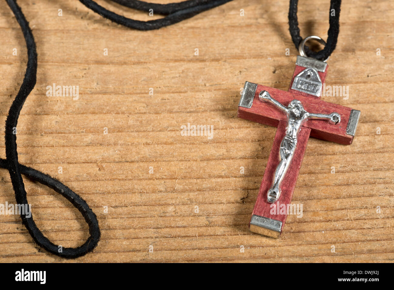 a cross on the old wooden desk Stock Photo - Alamy