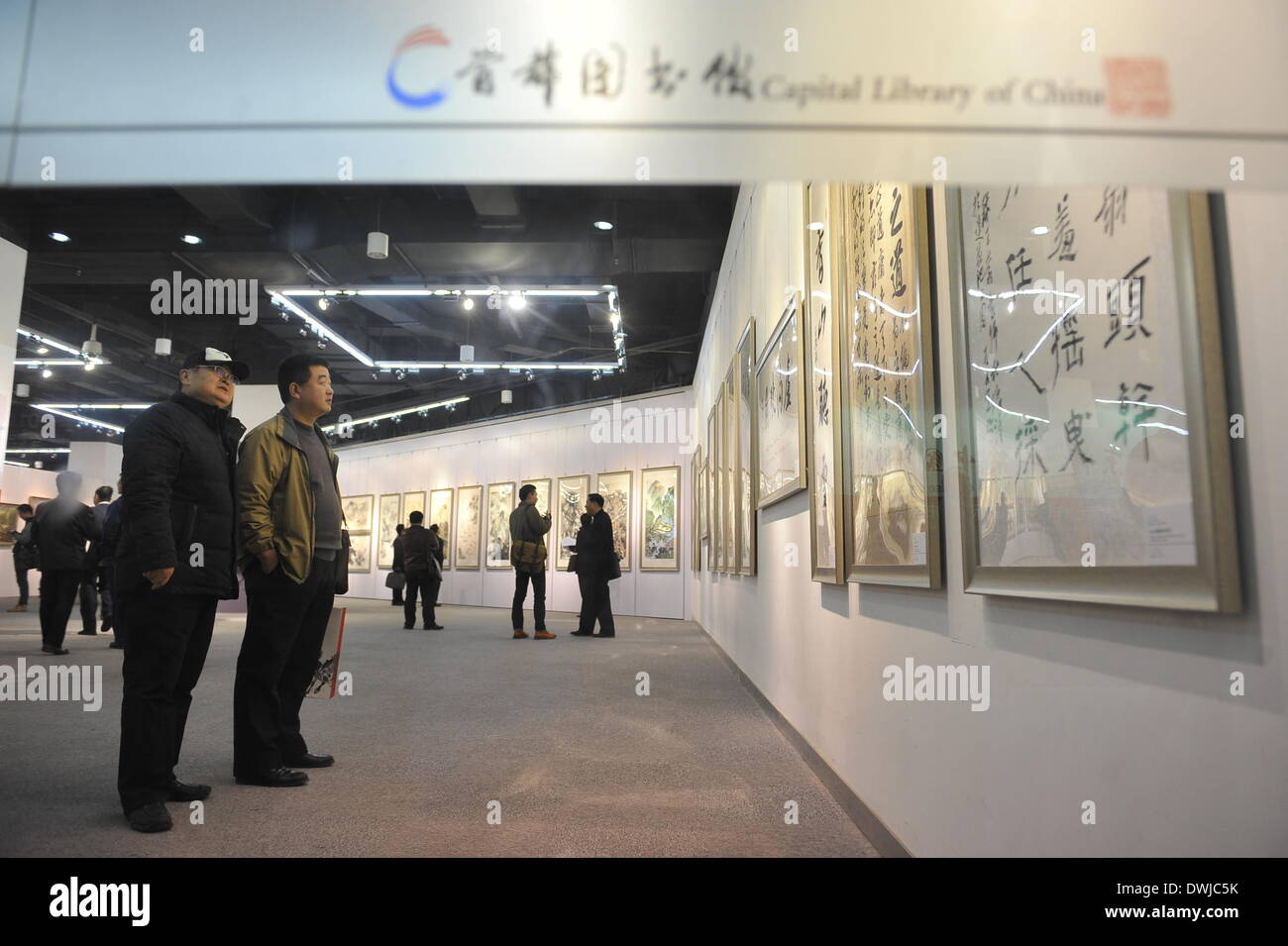 Beijing, China. 10th Mar, 2014. People visit an exhibition of ...