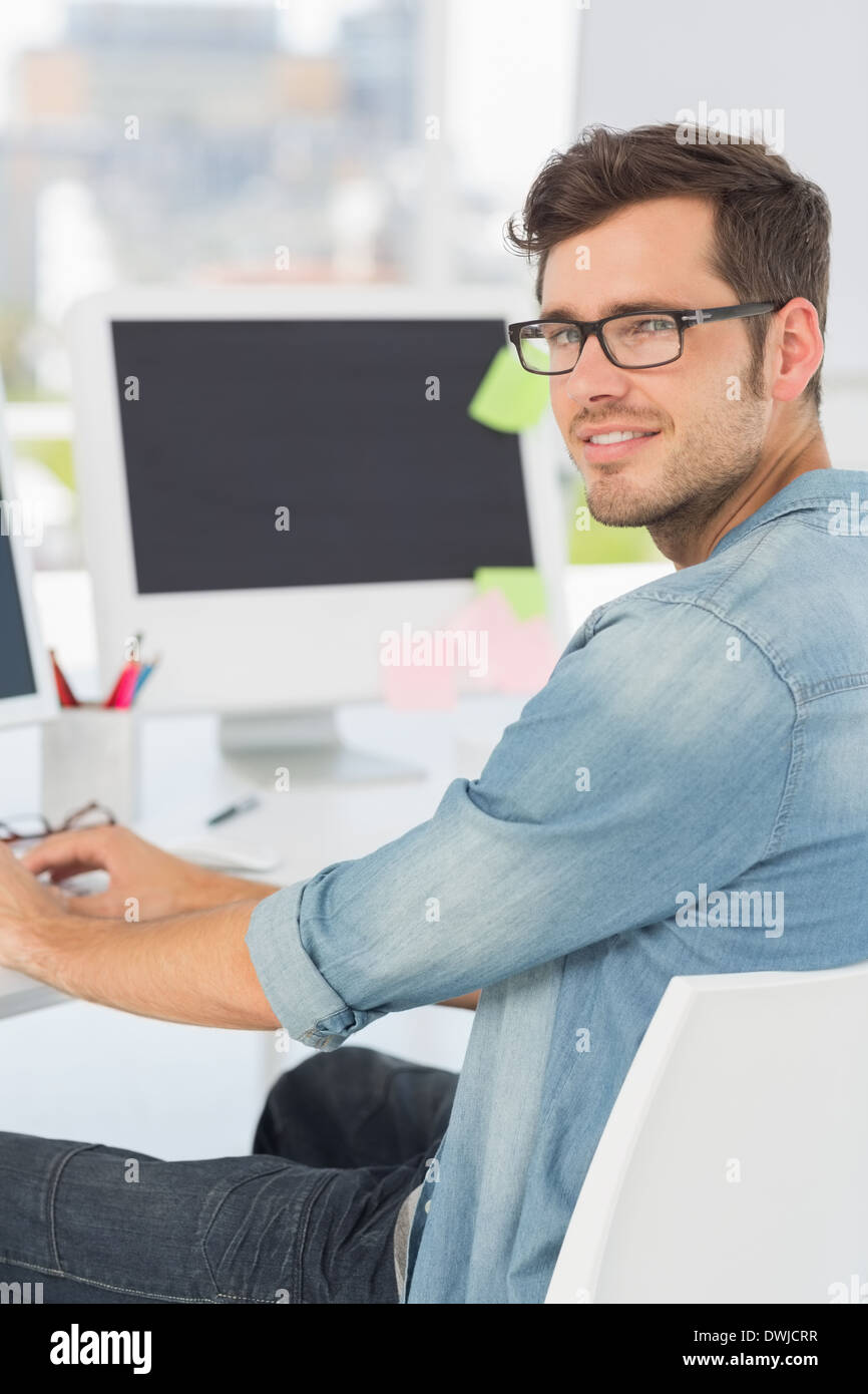 Side view portrait of a male artist using computer Stock Photo - Alamy