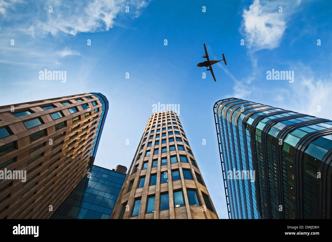 plane over office buildings Stock Photo - Alamy