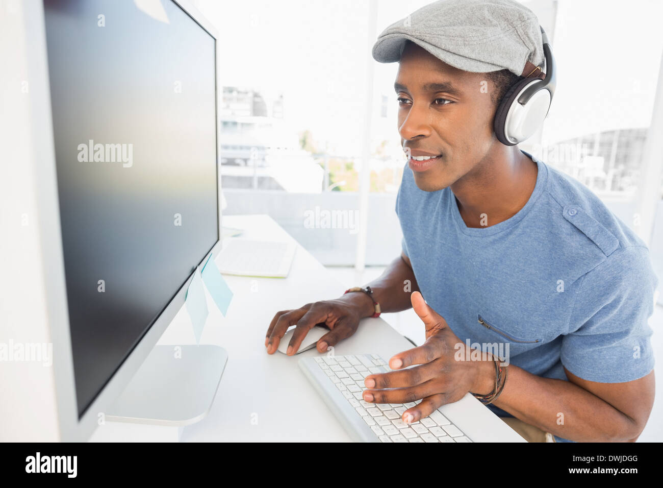 Male artist using computer in the office Stock Photo - Alamy
