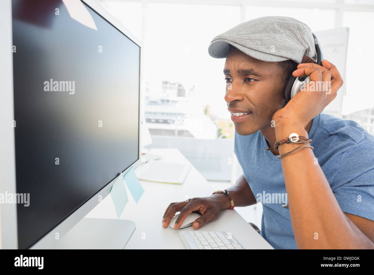 Male artist using computer in the office Stock Photo - Alamy