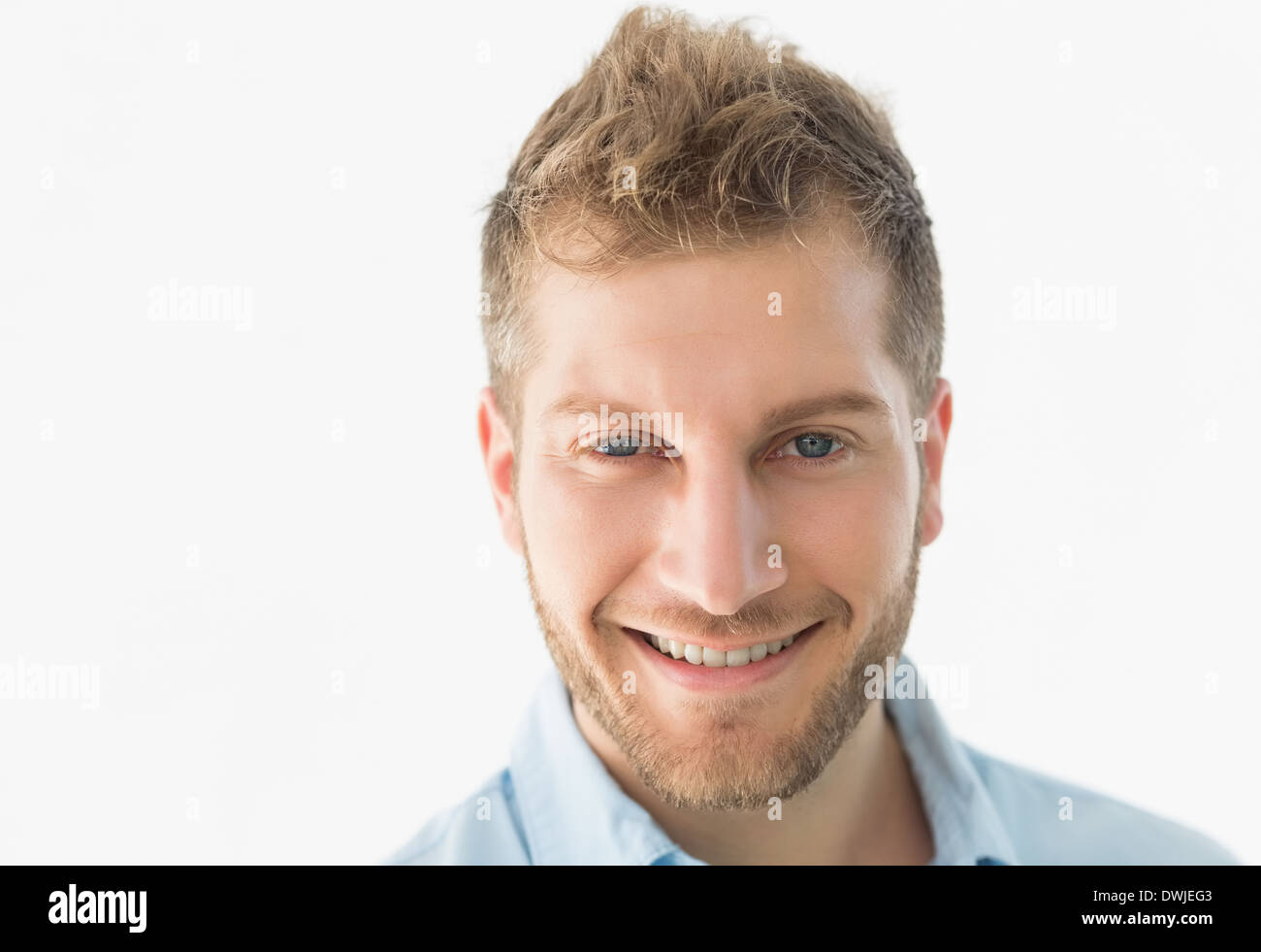 Confident young man smiling hi-res stock photography and images - Alamy