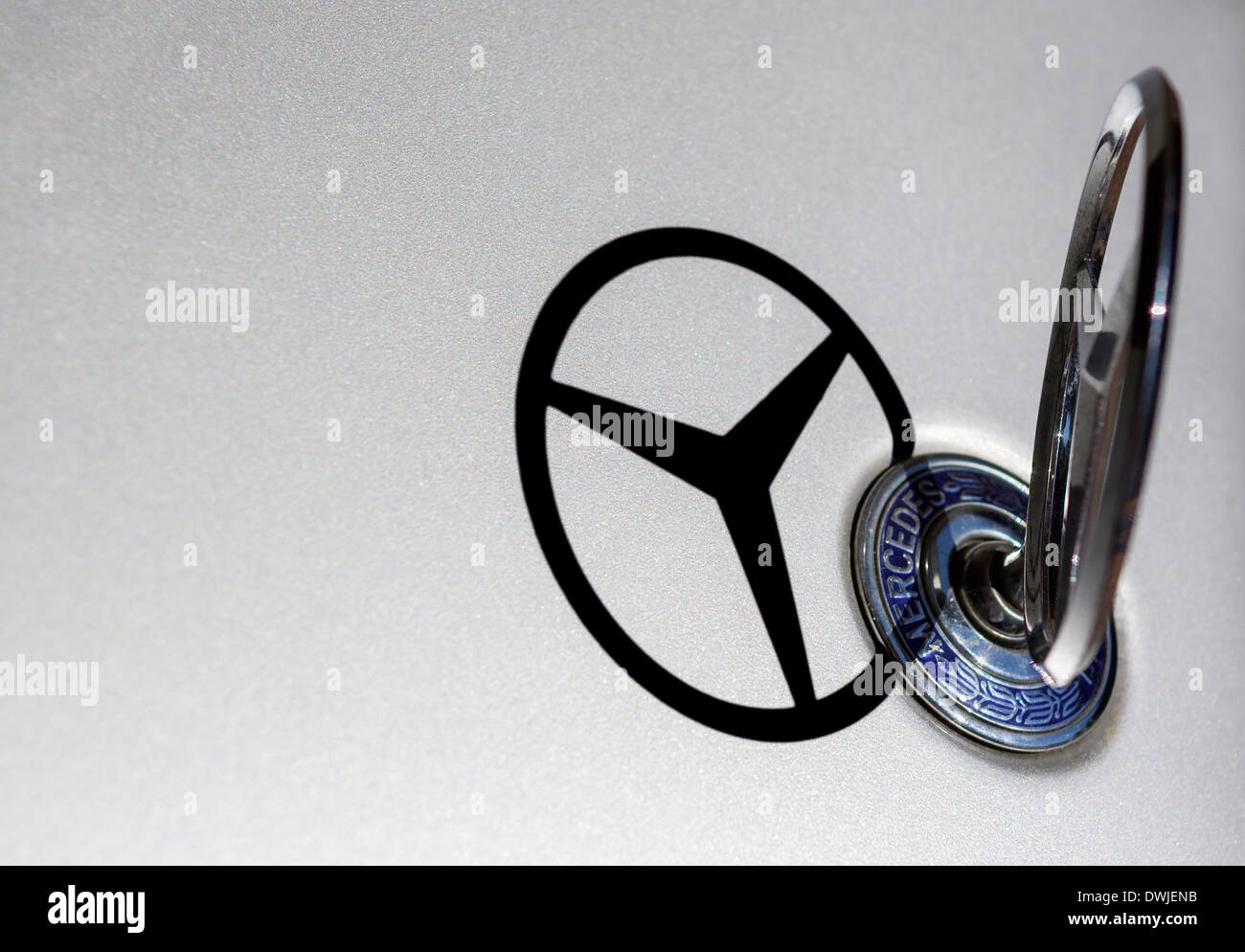 A Mercedes automobile (car) bonnet / hood Star Emblem casting a shadow ...