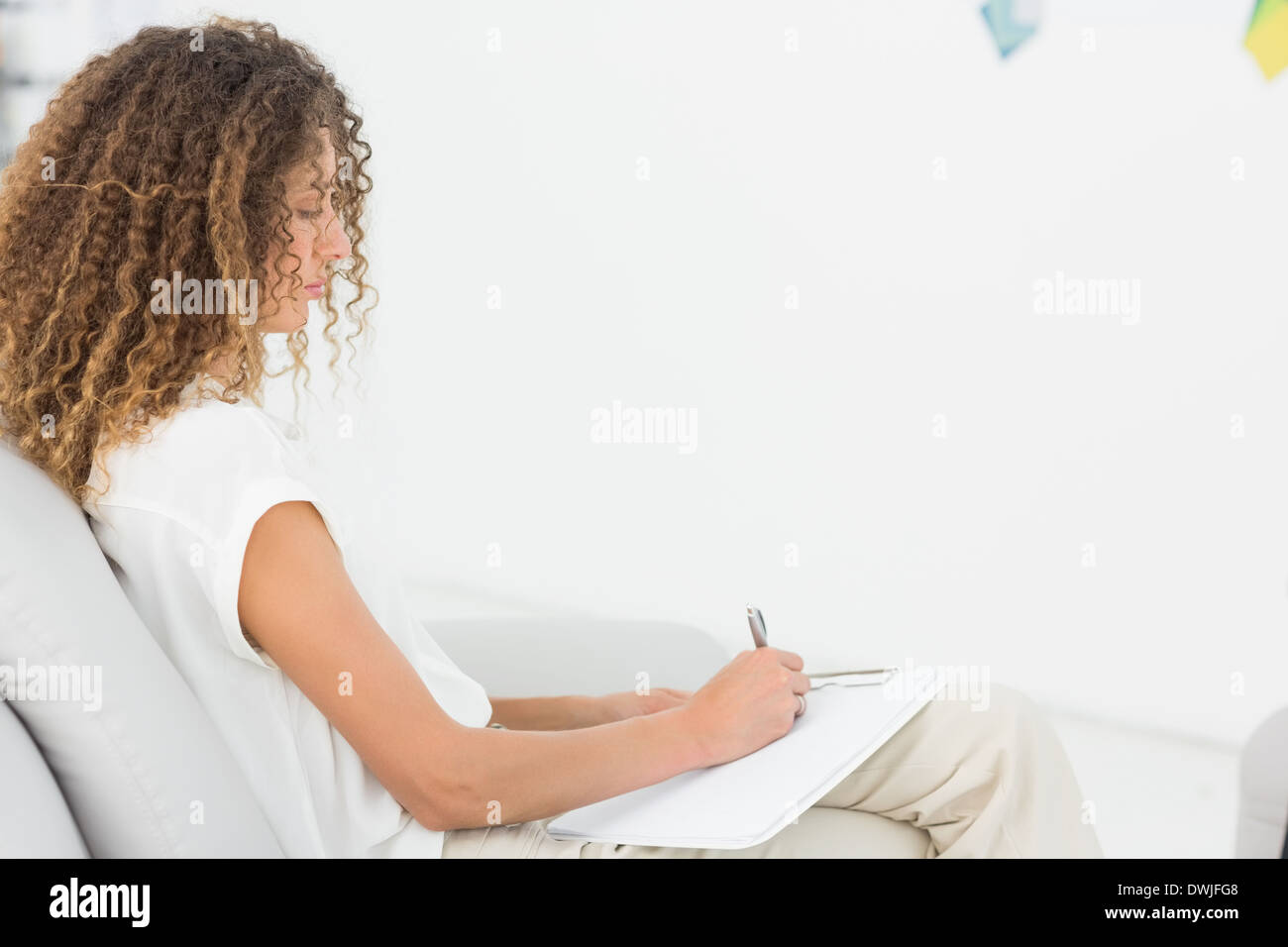 Psychologist taking notes on clipboard hi-res stock photography and ...