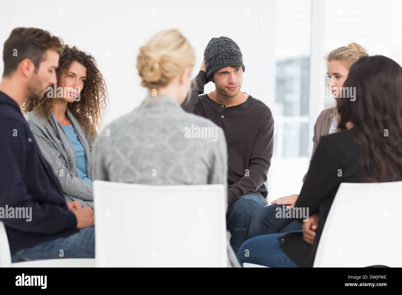 Group talking serious hi-res stock photography and images - Alamy