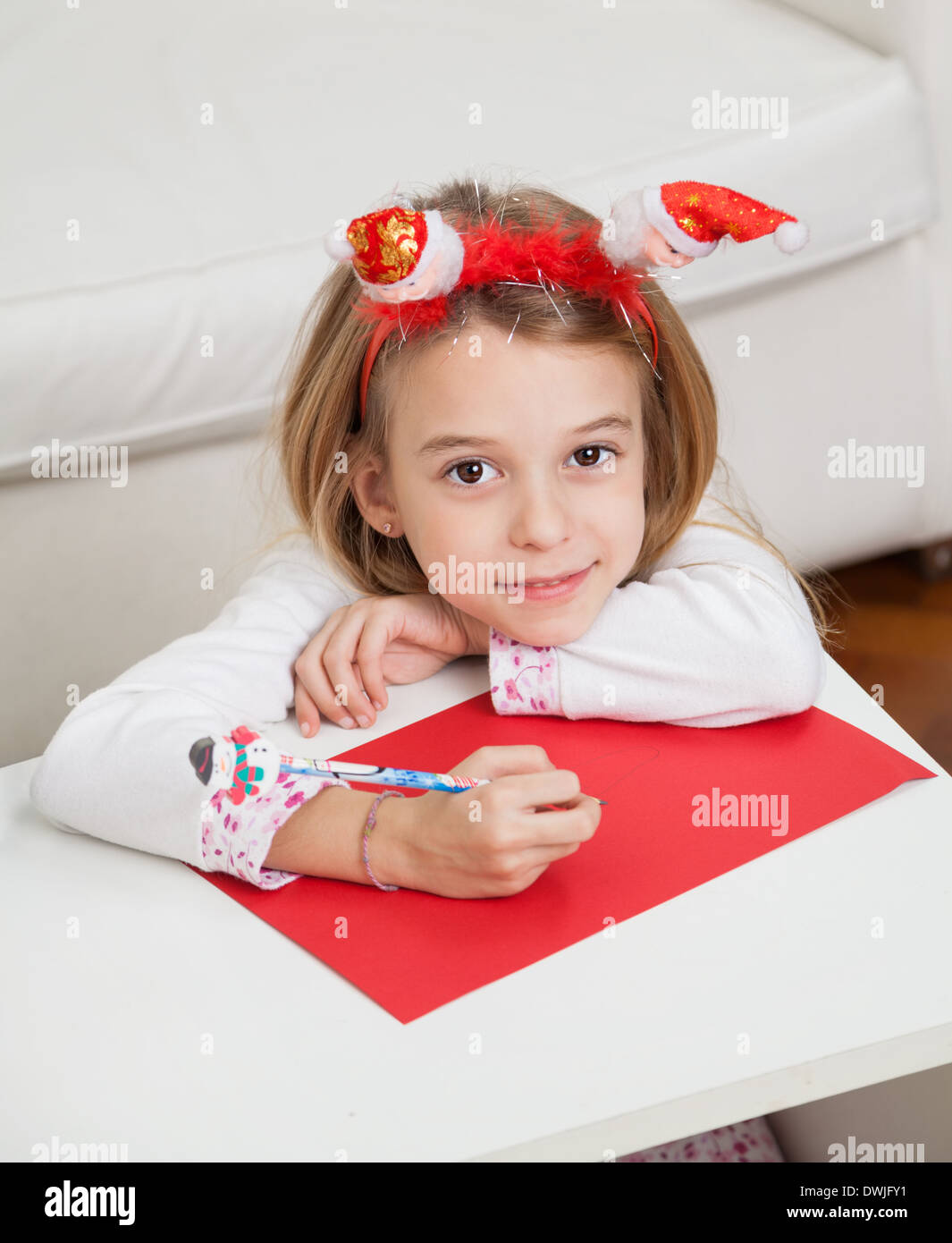 Girl Making Christmas Greeting Card Stock Photo - Alamy