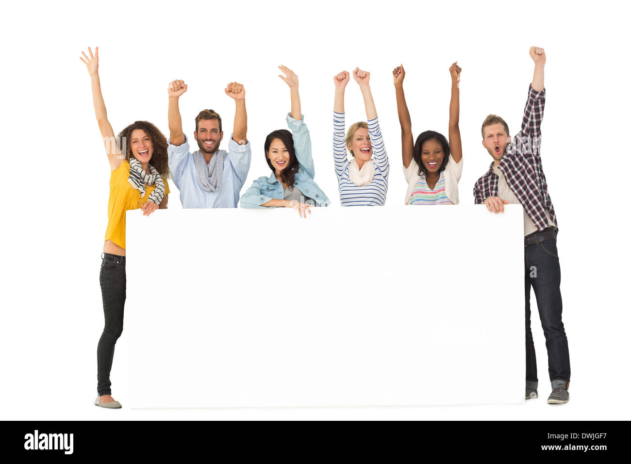 Smiling group of young friends showing large poster and cheering Stock ...
