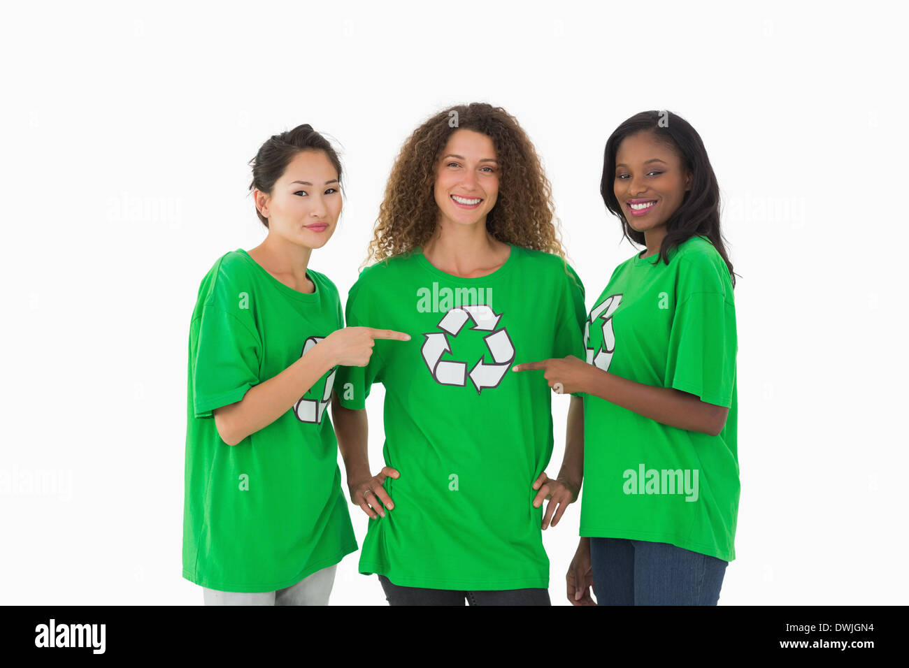 Team of environmental activists smiling at camera with hands together ...