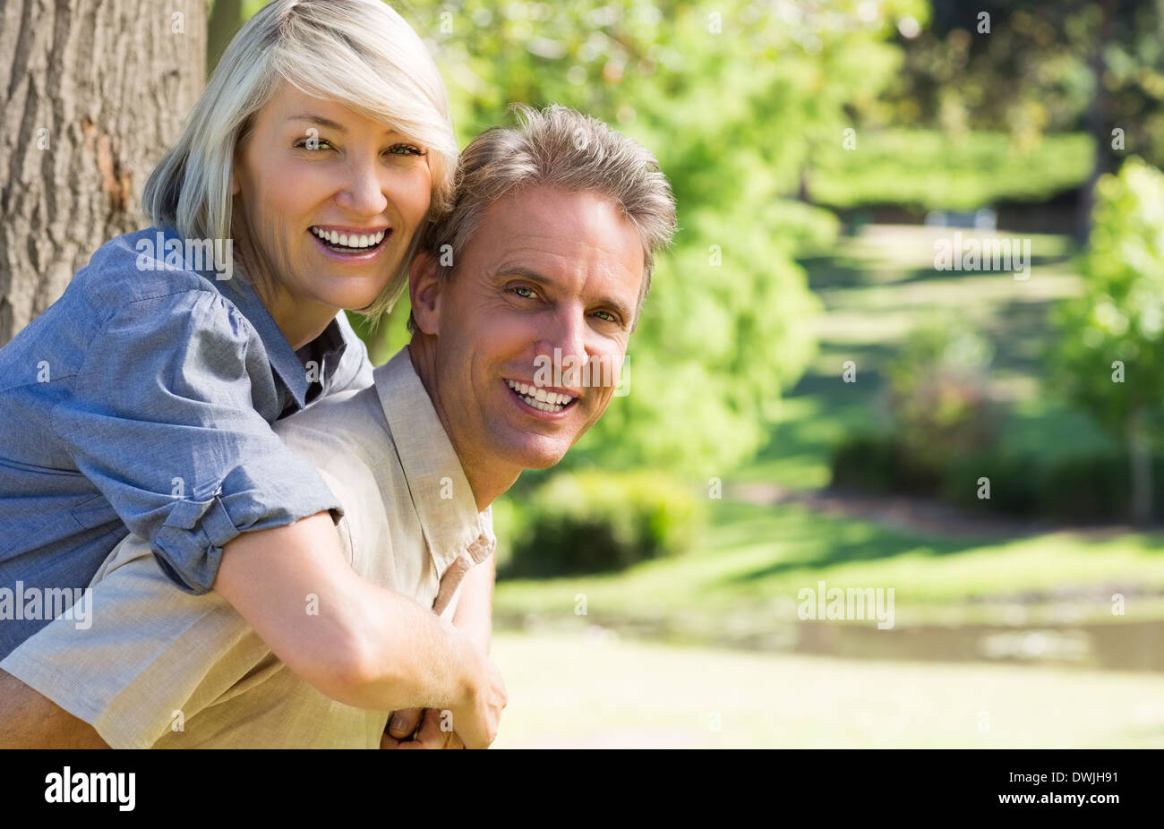 Couple enjoying piggyback ride Stock Photo - Alamy