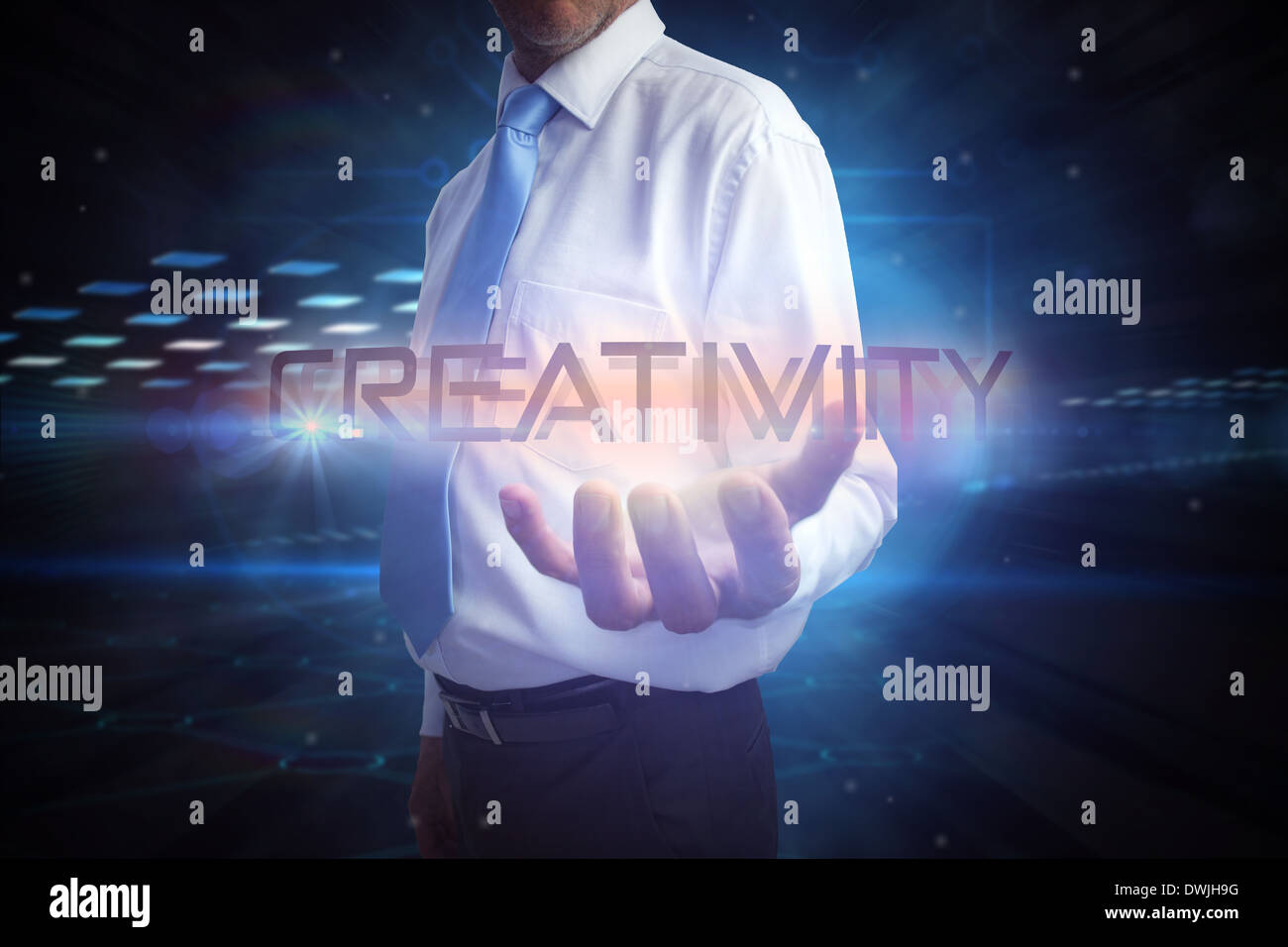 Businessman presenting the word creativity Stock Photo - Alamy