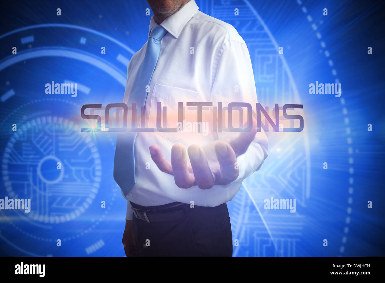 Businessman presenting the word solutions Stock Photo - Alamy