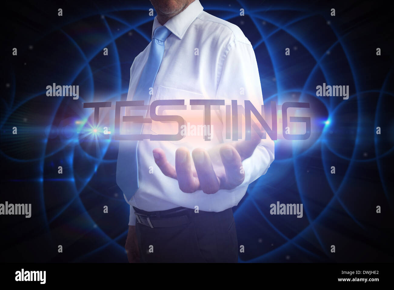 Businessman presenting the word testing Stock Photo - Alamy
