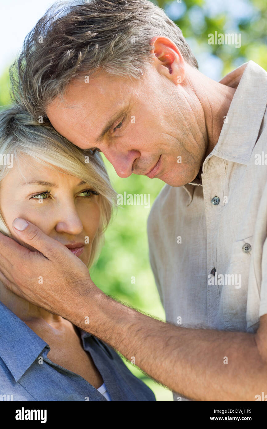 Couple consoling in park hi-res stock photography and images - Alamy