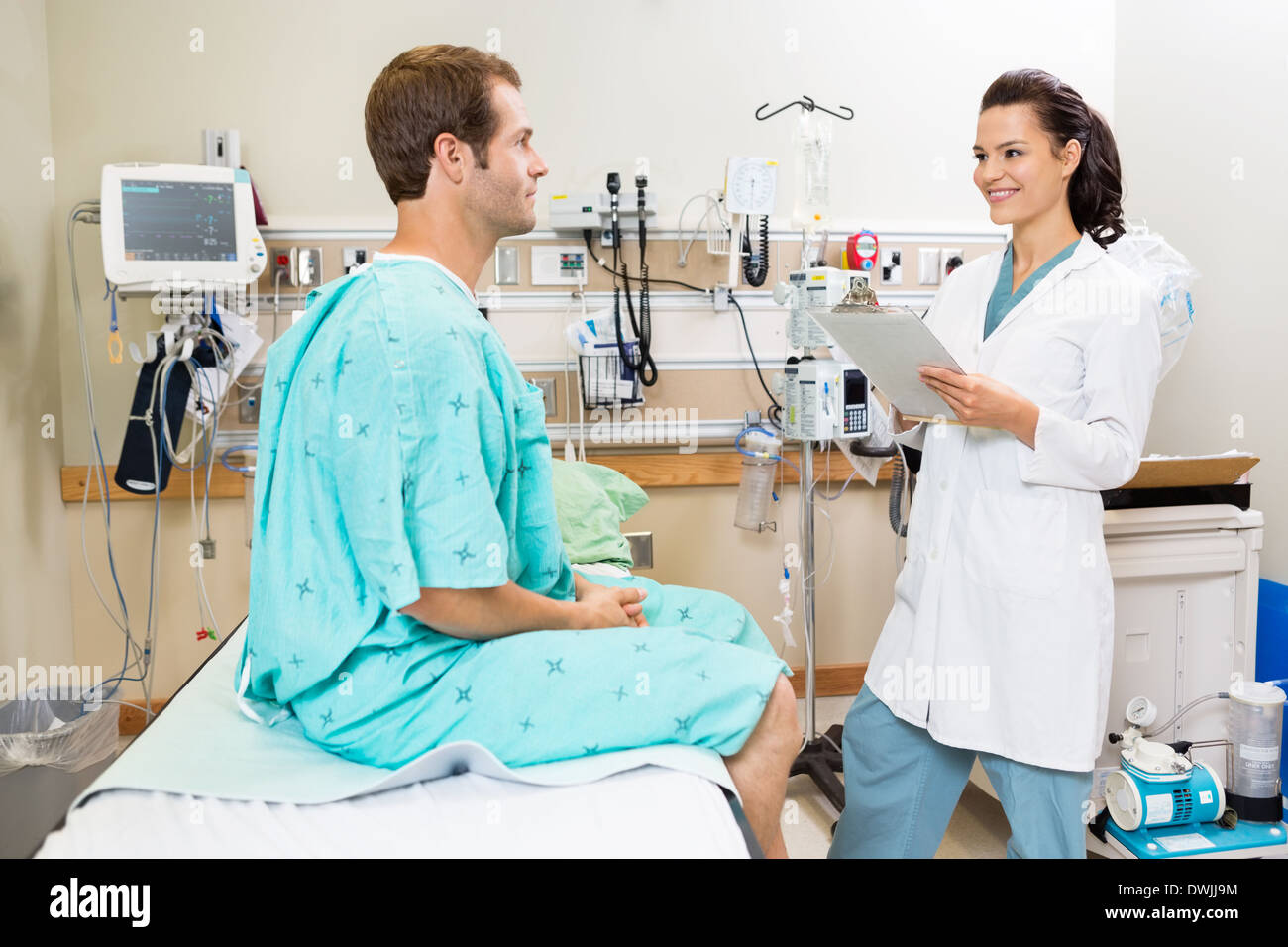 Doctor With Clipboard Checking Patient's Report Stock Photo - Alamy