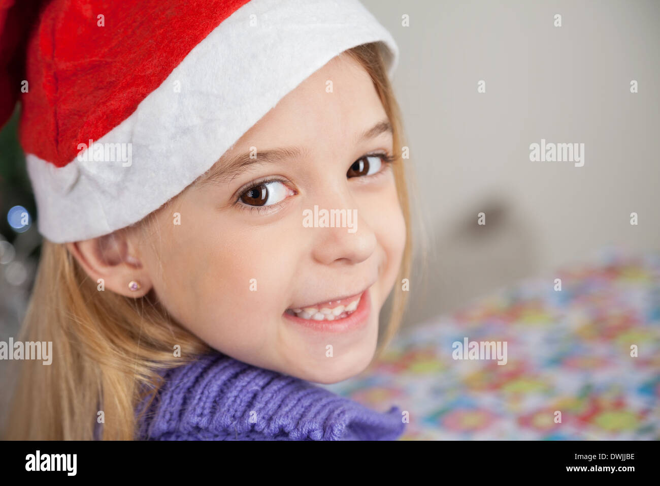 Girl wearing santa hat hi-res stock photography and images - Alamy