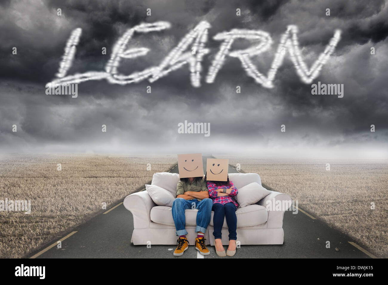Learn against misty brown landscape with street Stock Photo - Alamy
