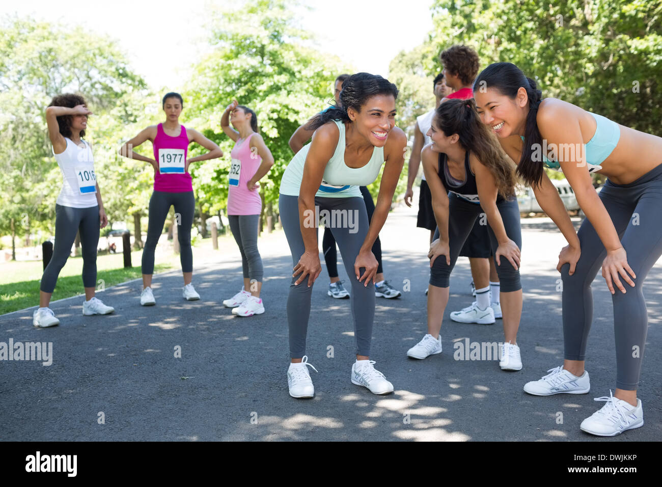 Marathon runners taking a break Stock Photo - Alamy