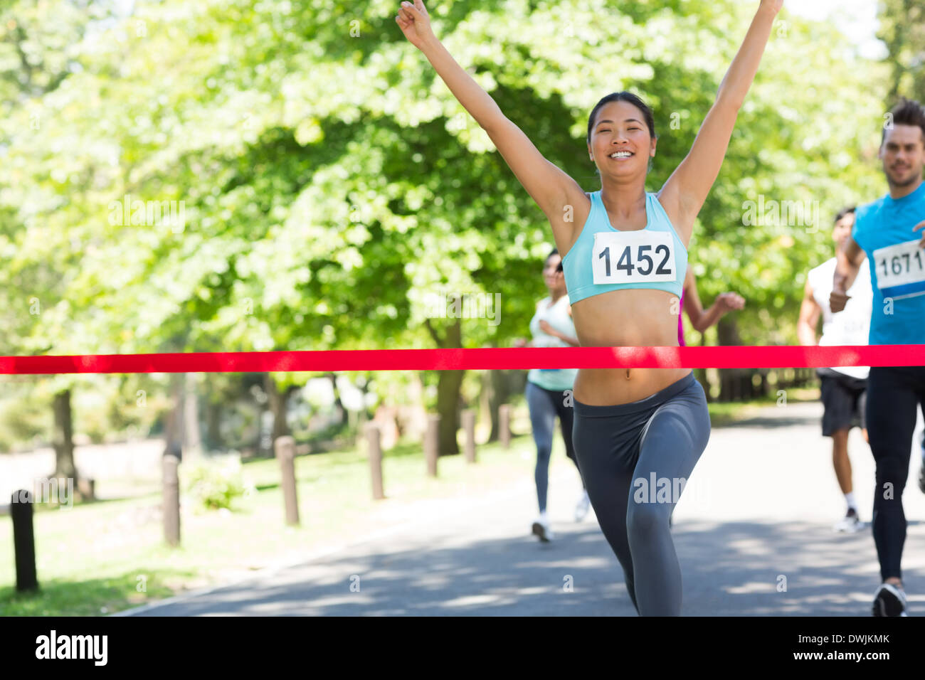 Female marathon winner Stock Photo - Alamy