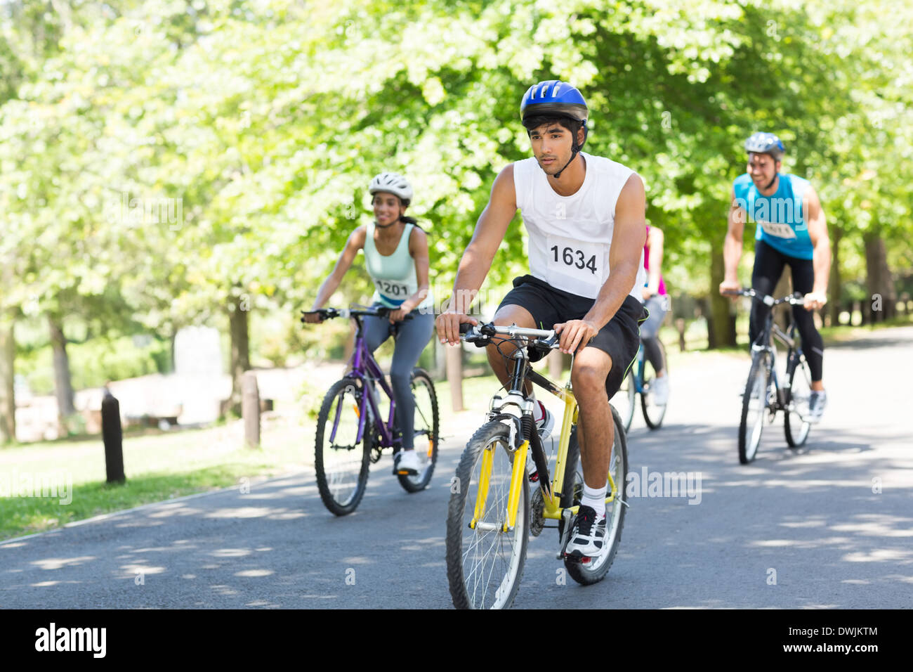 Adult cyclists riding bicycles hi-res stock photography and images - Alamy