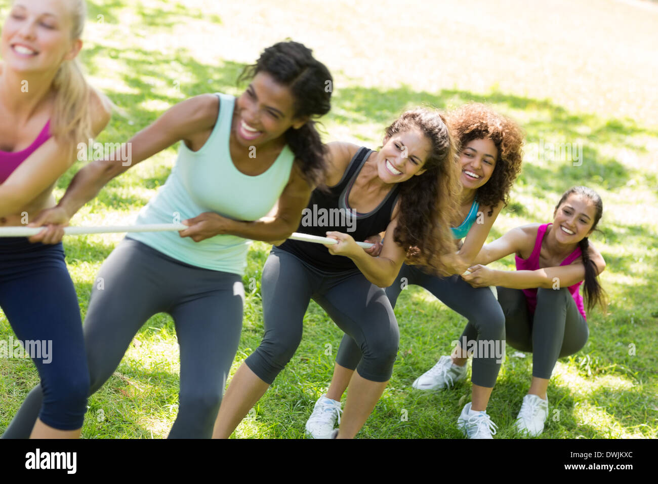 Women pulling a rope in tug of war Stock Photo - Alamy