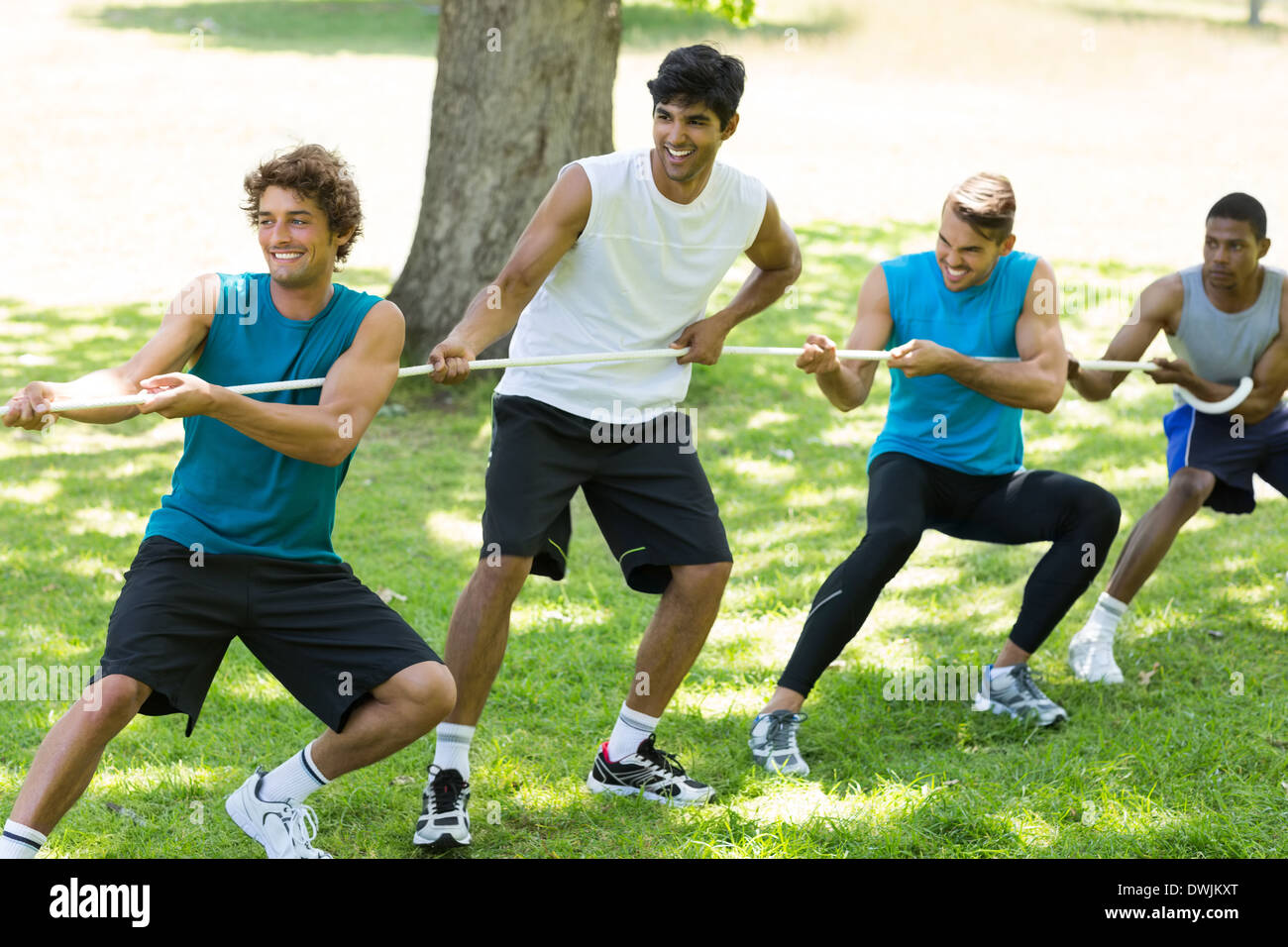 Fitness group playing tug war hi-res stock photography and images - Alamy