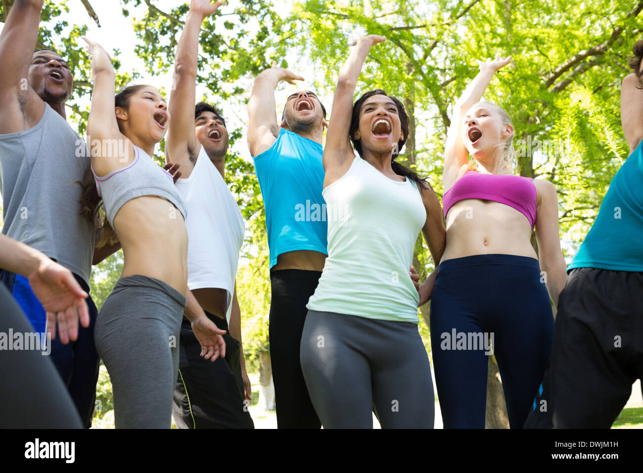 Sporty friends screaming at park Stock Photo - Alamy