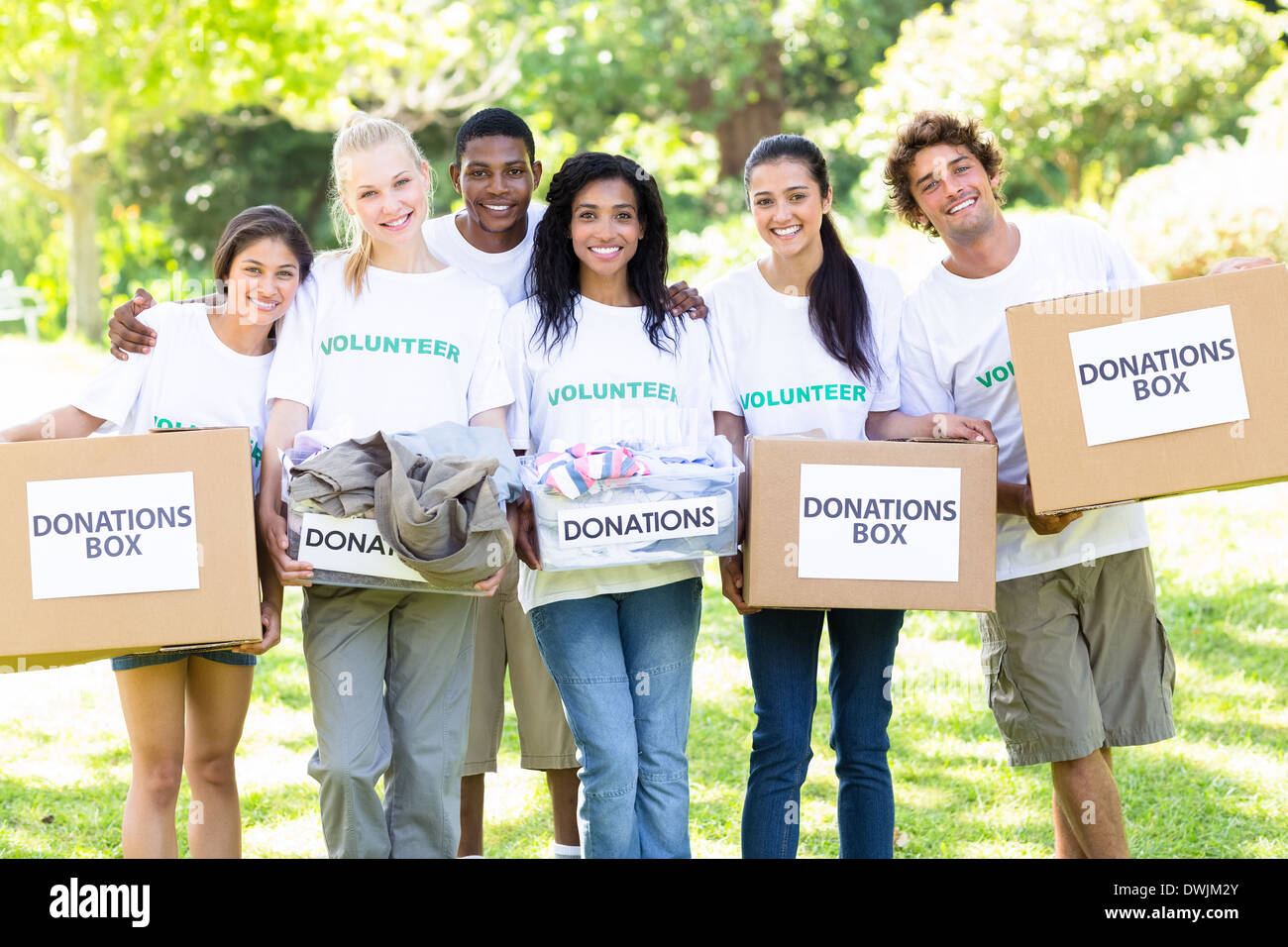 Volunteers carrying donation boxes Stock Photo - Alamy