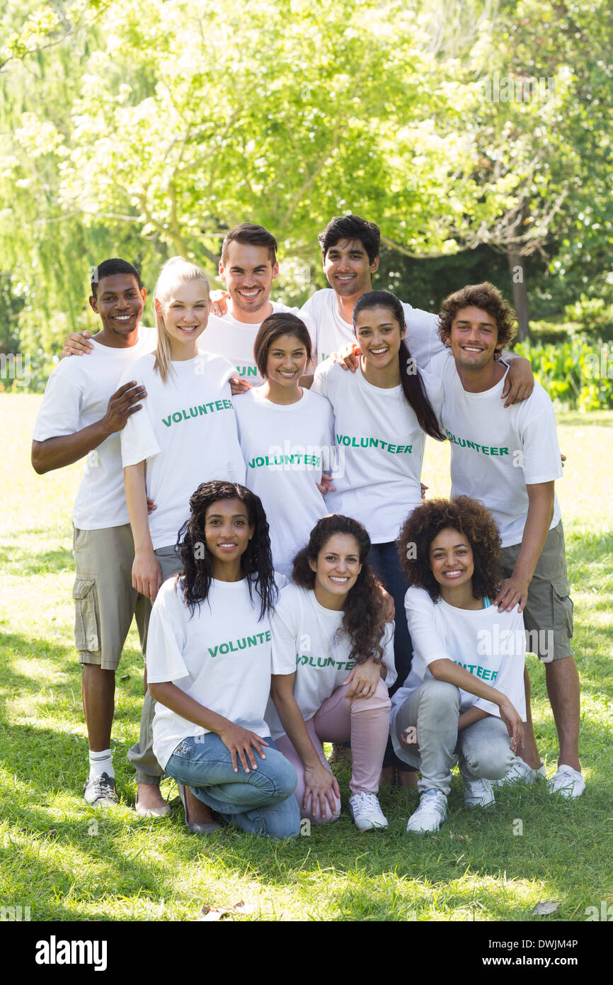 Group volunteers standing arm around hi-res stock photography and ...