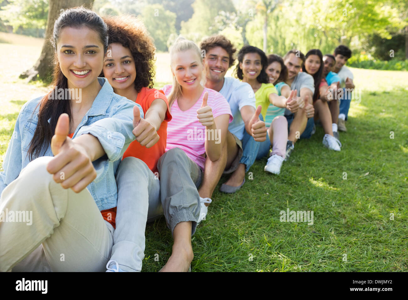 Positive friends sitting thumbs up hi-res stock photography and images ...