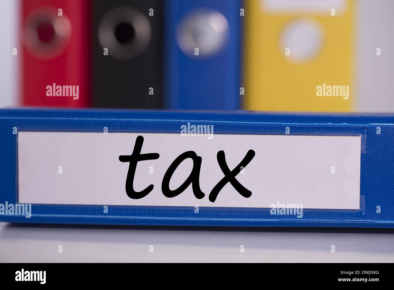 Tax text on blue hi-res stock photography and images - Alamy