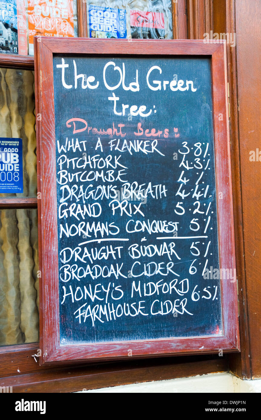 Hand written sign outside The Old Green Tree pub bar showing draught ...