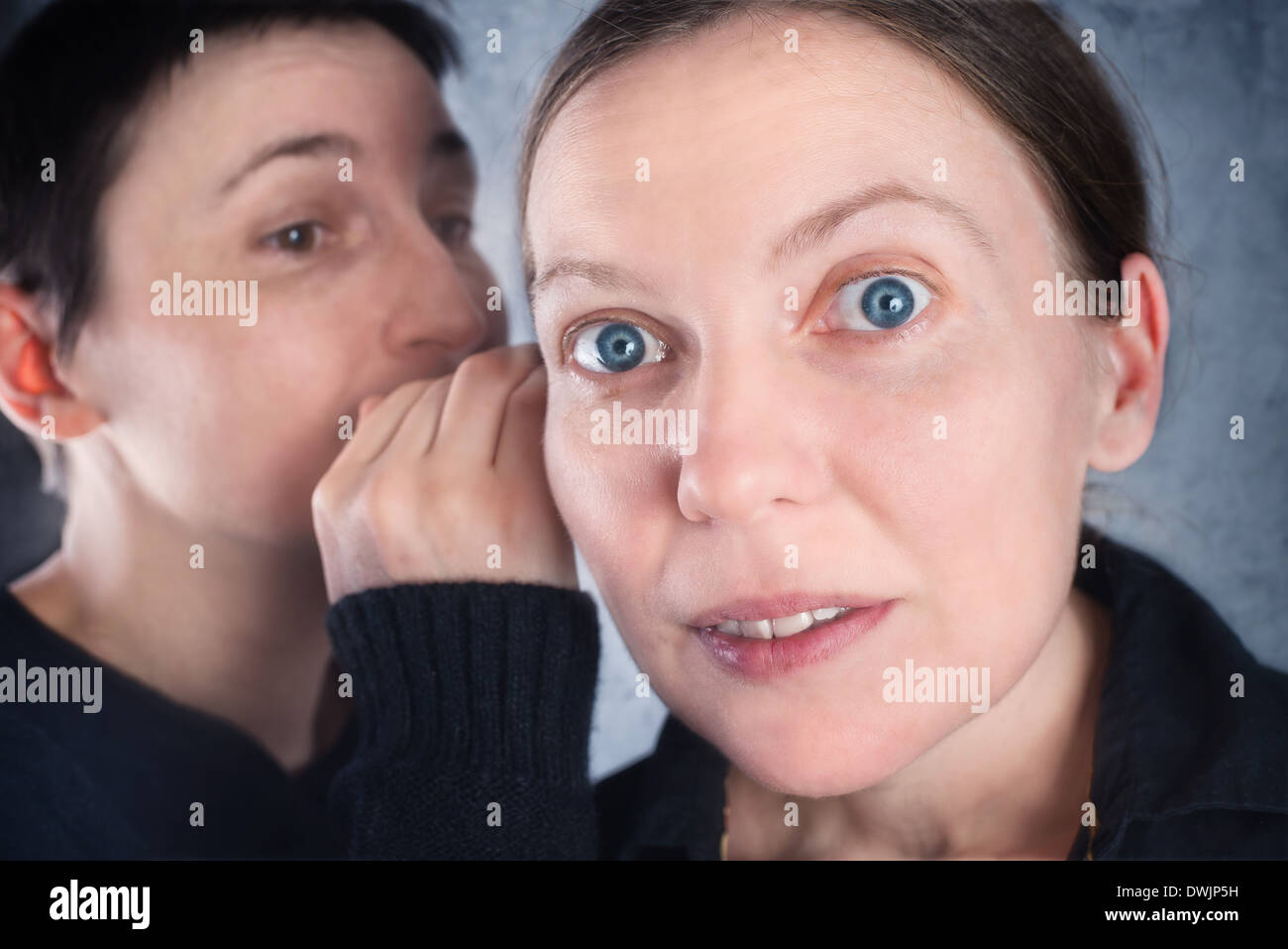 Adult telling of another adult hi-res stock photography and images - Alamy