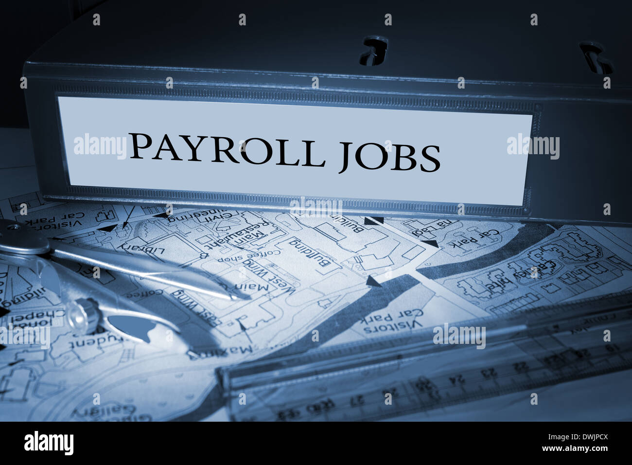 Payroll jobs on blue business binder Stock Photo - Alamy