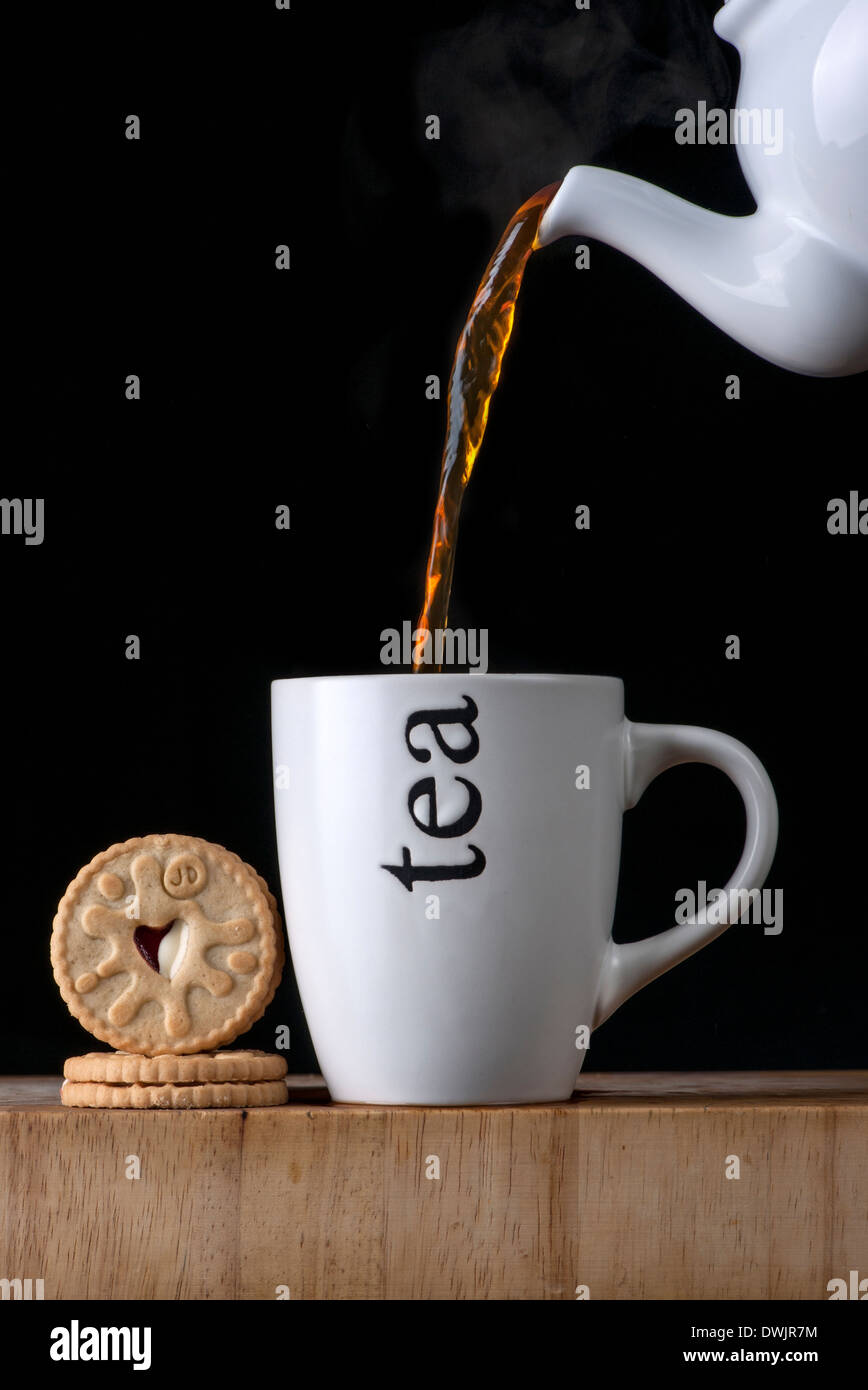 Tea pouring into cup hi-res stock photography and images - Alamy