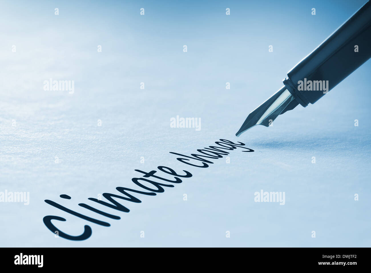 Fountain pen writing Climate change Stock Photo - Alamy