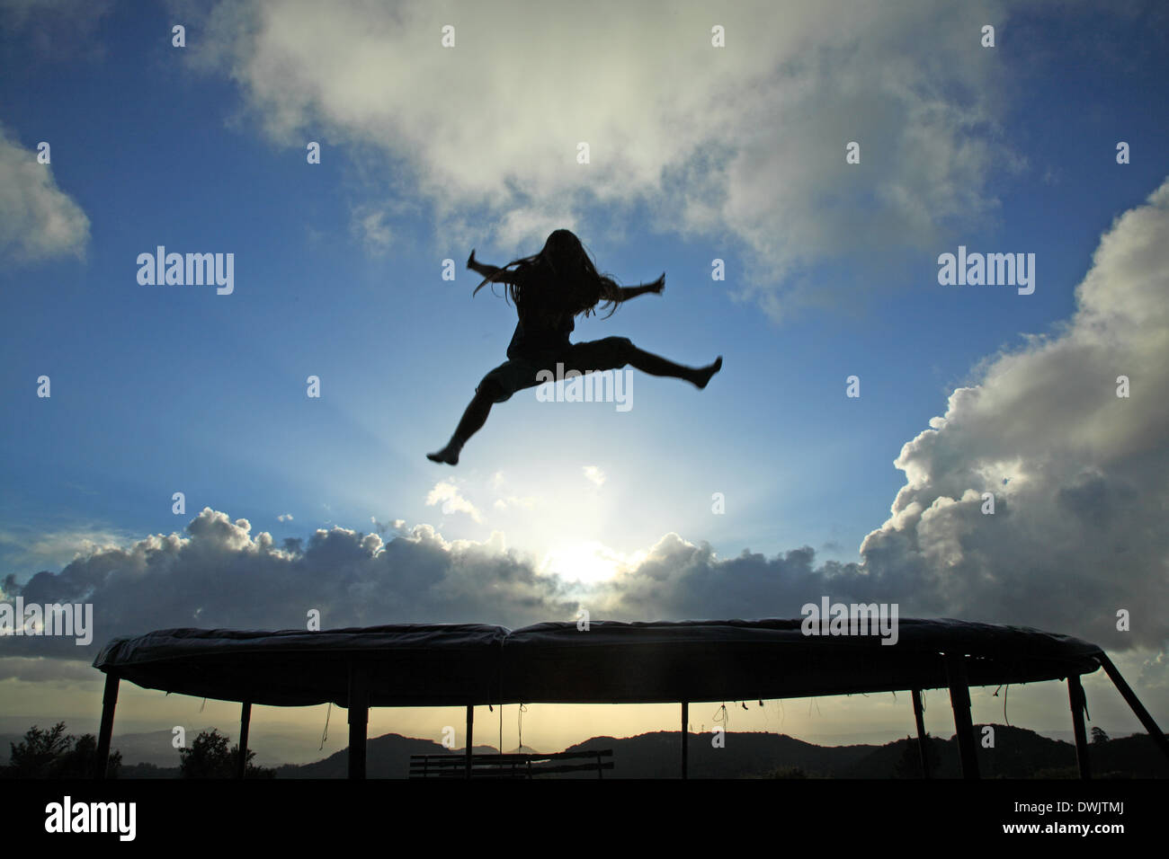 Girl Jumping Trampoline, Brazil, Rio Grande do Sul Stock Photo - Alamy