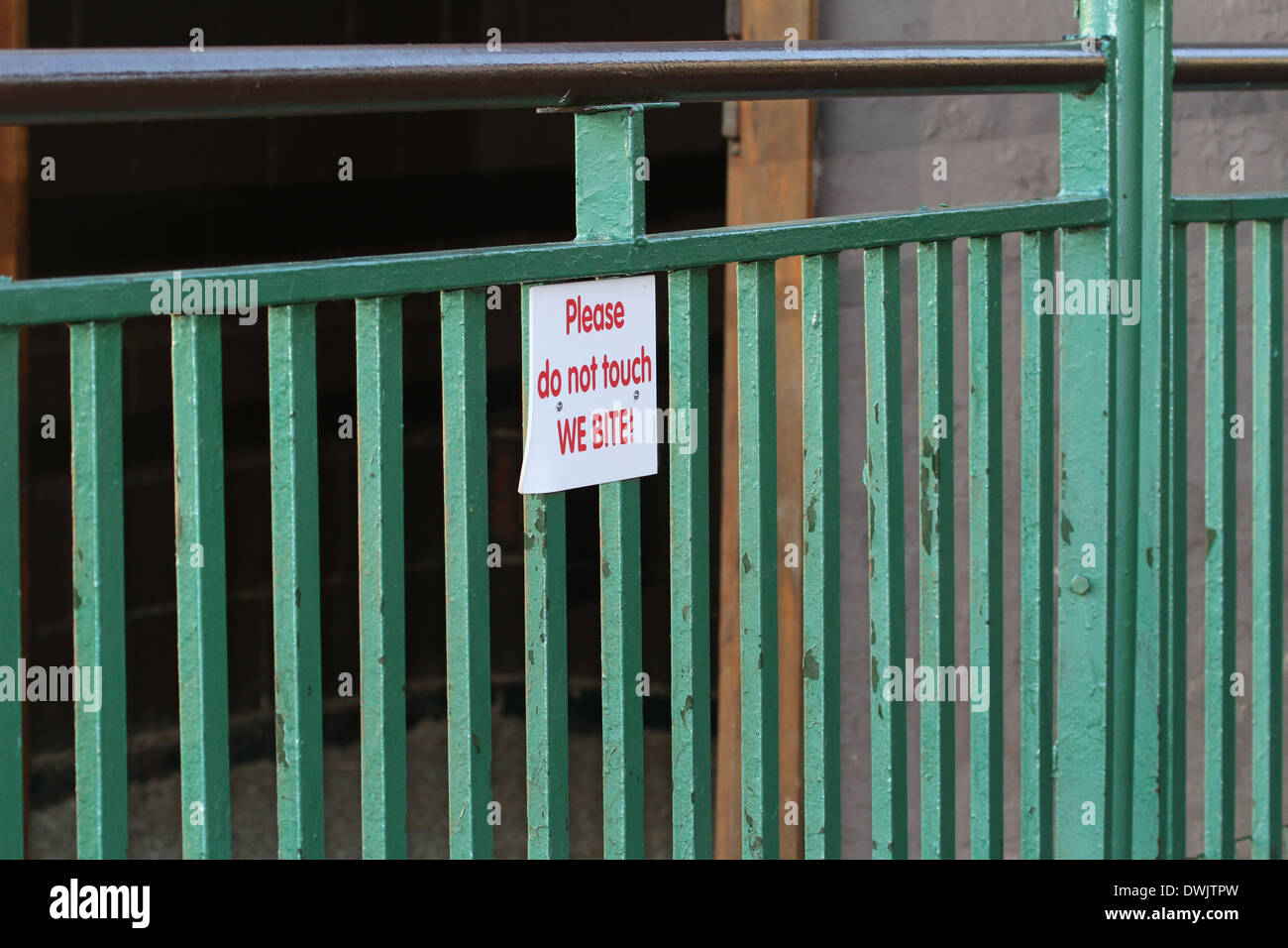 please do not touch feed the animals we bite sign screwed to metal ...