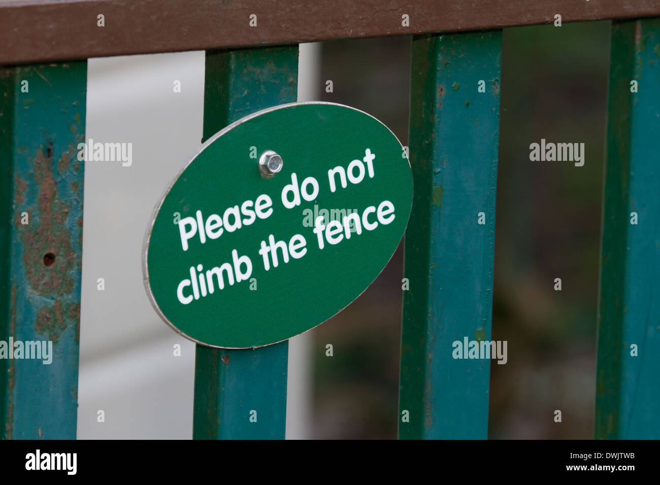 dirty broken no do not climb on the fence gate barrier sign screwed to ...