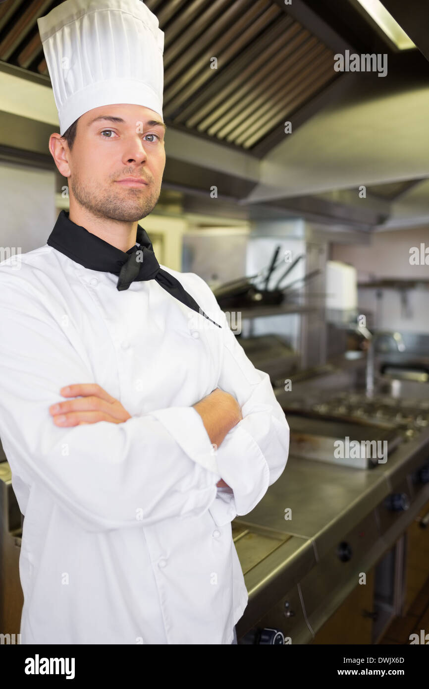 Serious male cook with arms crossed in kitchen Stock Photo - Alamy